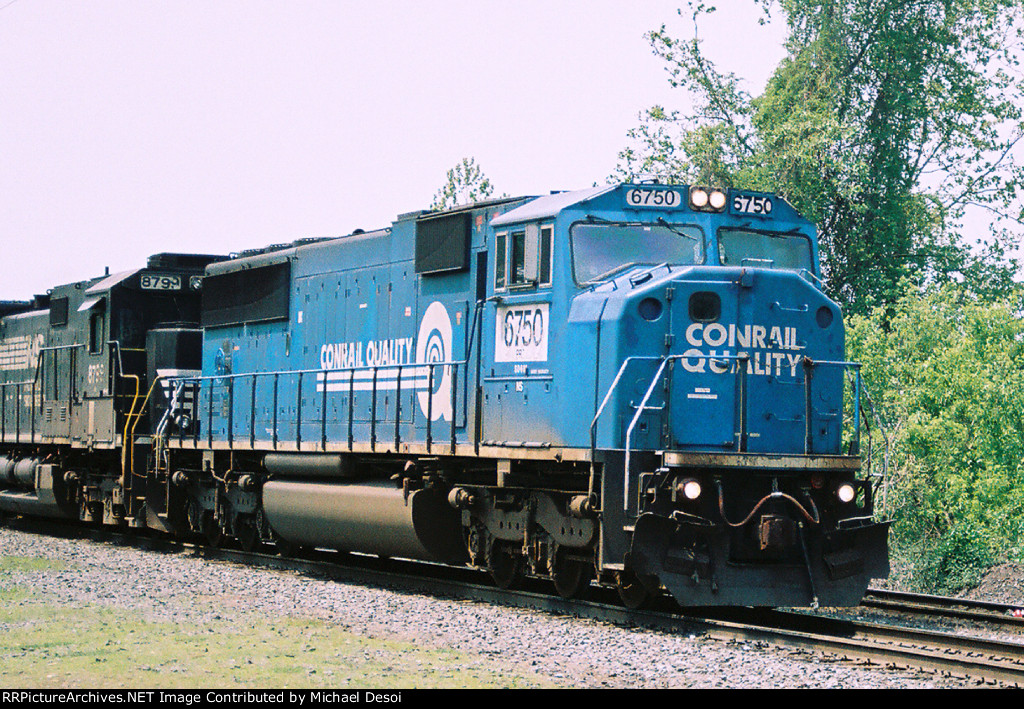 NS SD-60I #6750 leads an eastbound into the yard